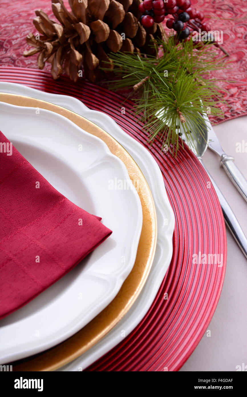 Traditional red theme festive table place setting for Christmas or ...