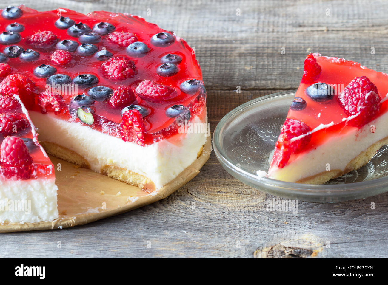 Cheesecake with the fresh raspberries and blueberries Stock Photo - Alamy