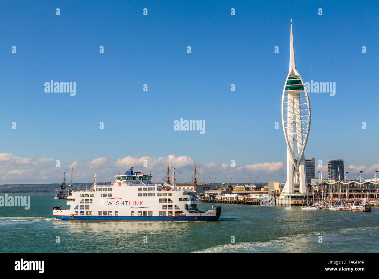 A White Link ferry passing the Spinnaker Tower in the solent and entering Portsmouth Harbour ...