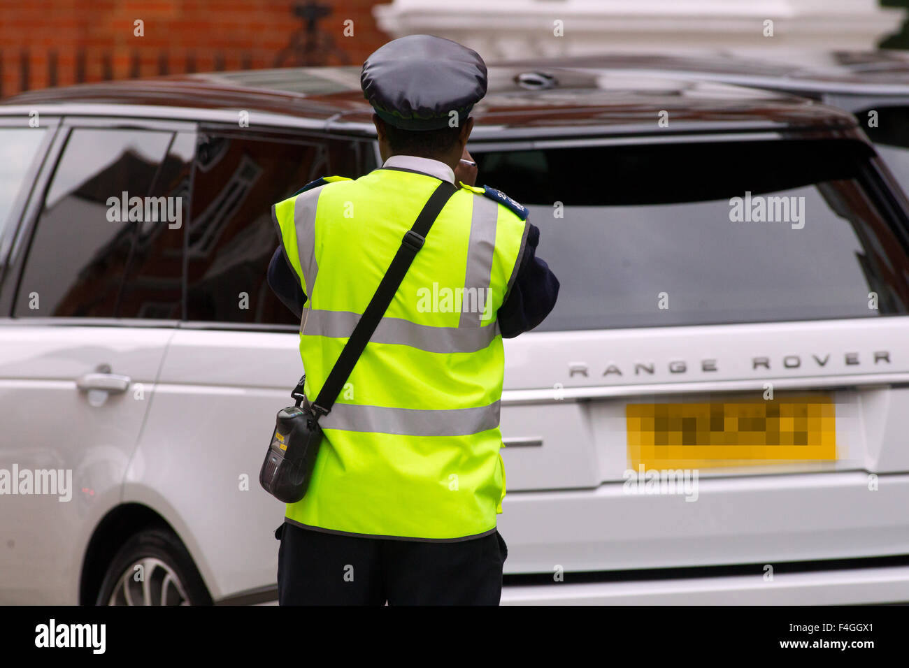 A traffic warden on patrol in London, Britain Stock Photo - Alamy