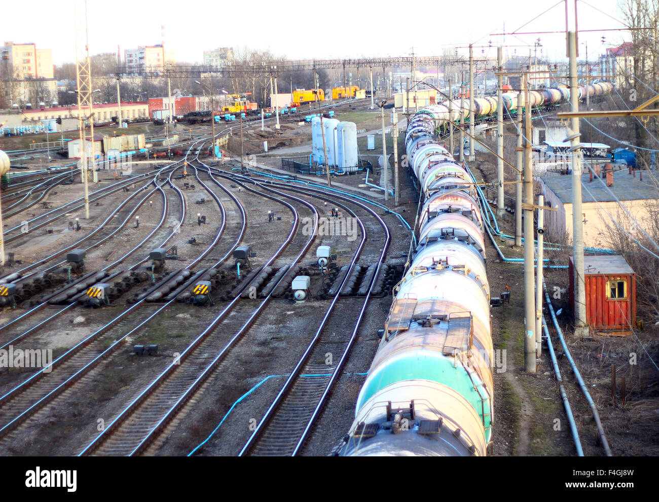 Long cargo train with cars under fuel Stock Photo - Alamy