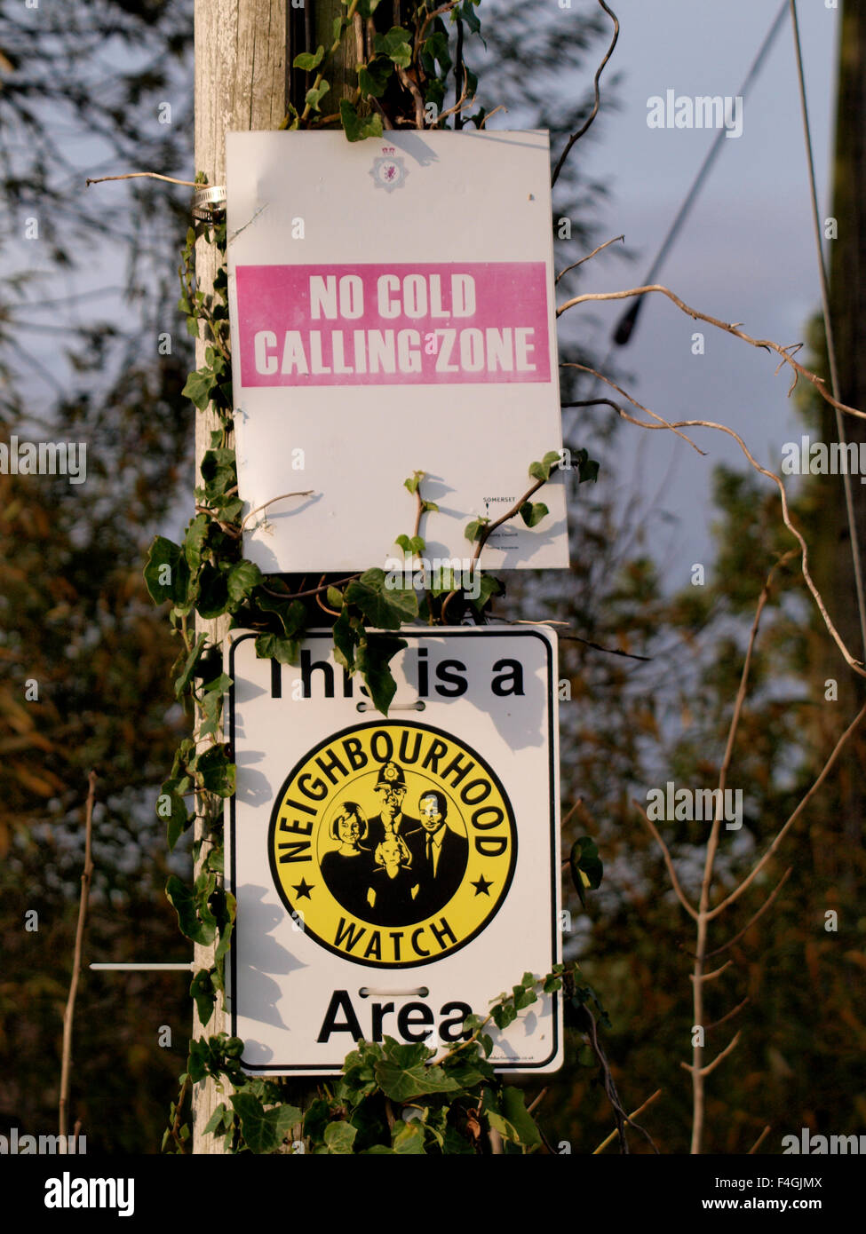 No Cold calling sign and Neighbourhood Watch sign on a telegraph post ...