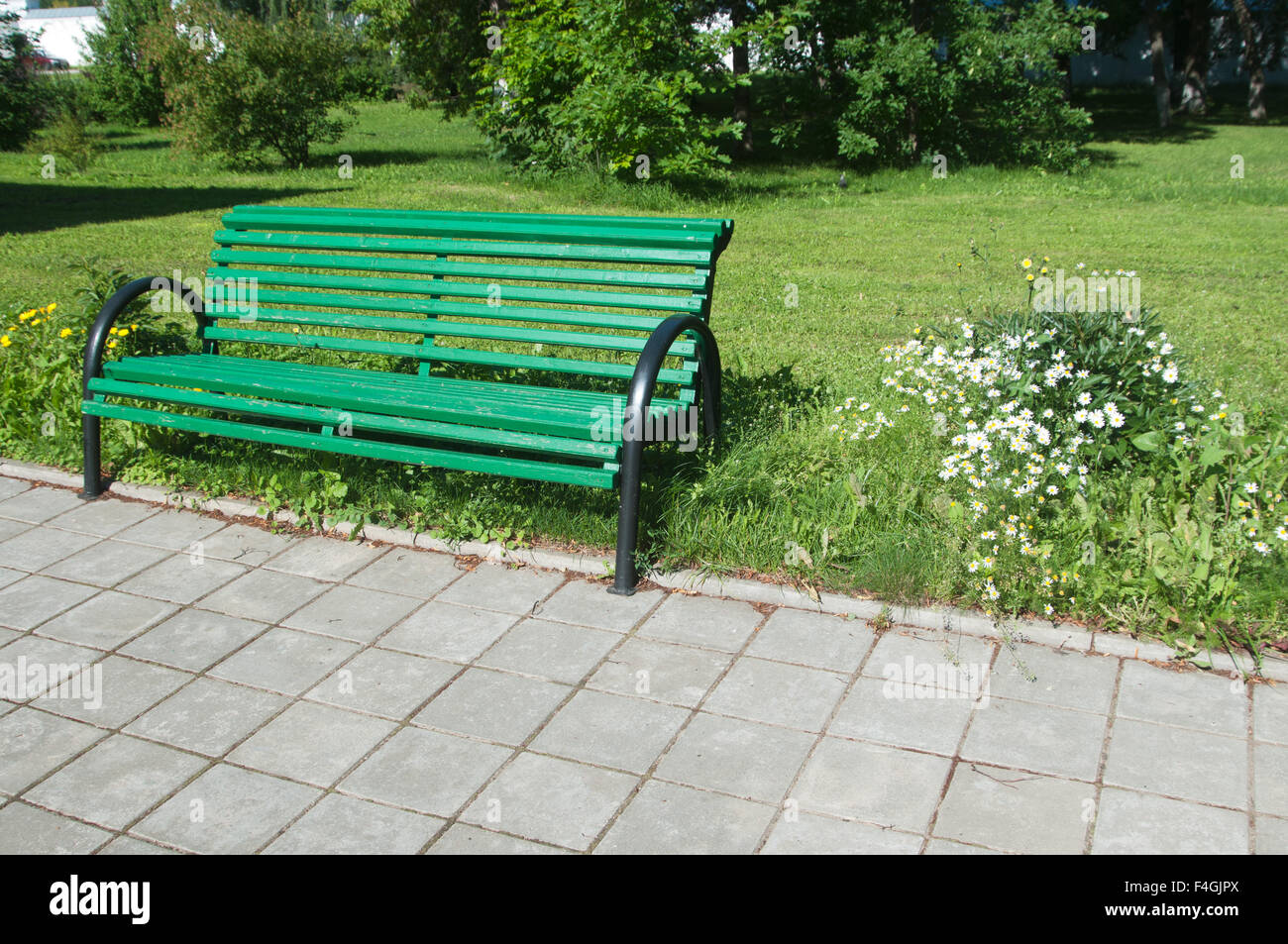 Park bench flowers in hi-res stock photography and images - Alamy