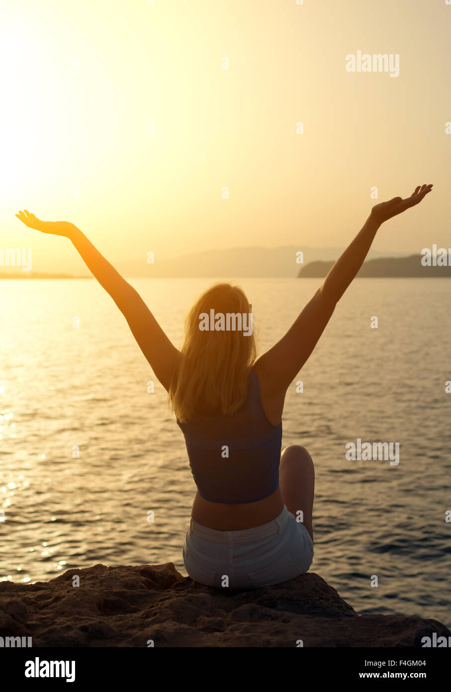Woman with arms wide open at sunset. Place for text Stock Photo - Alamy