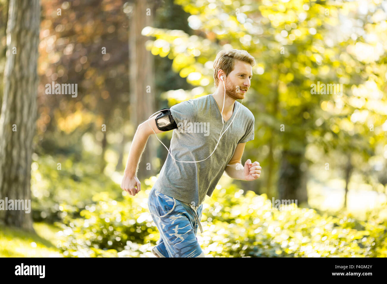 Sport man running in park hi-res stock photography and images - Alamy