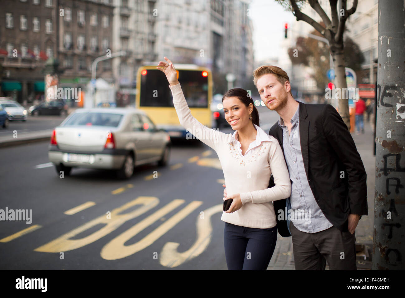 Bus stop people standing hi-res stock photography and images - Alamy