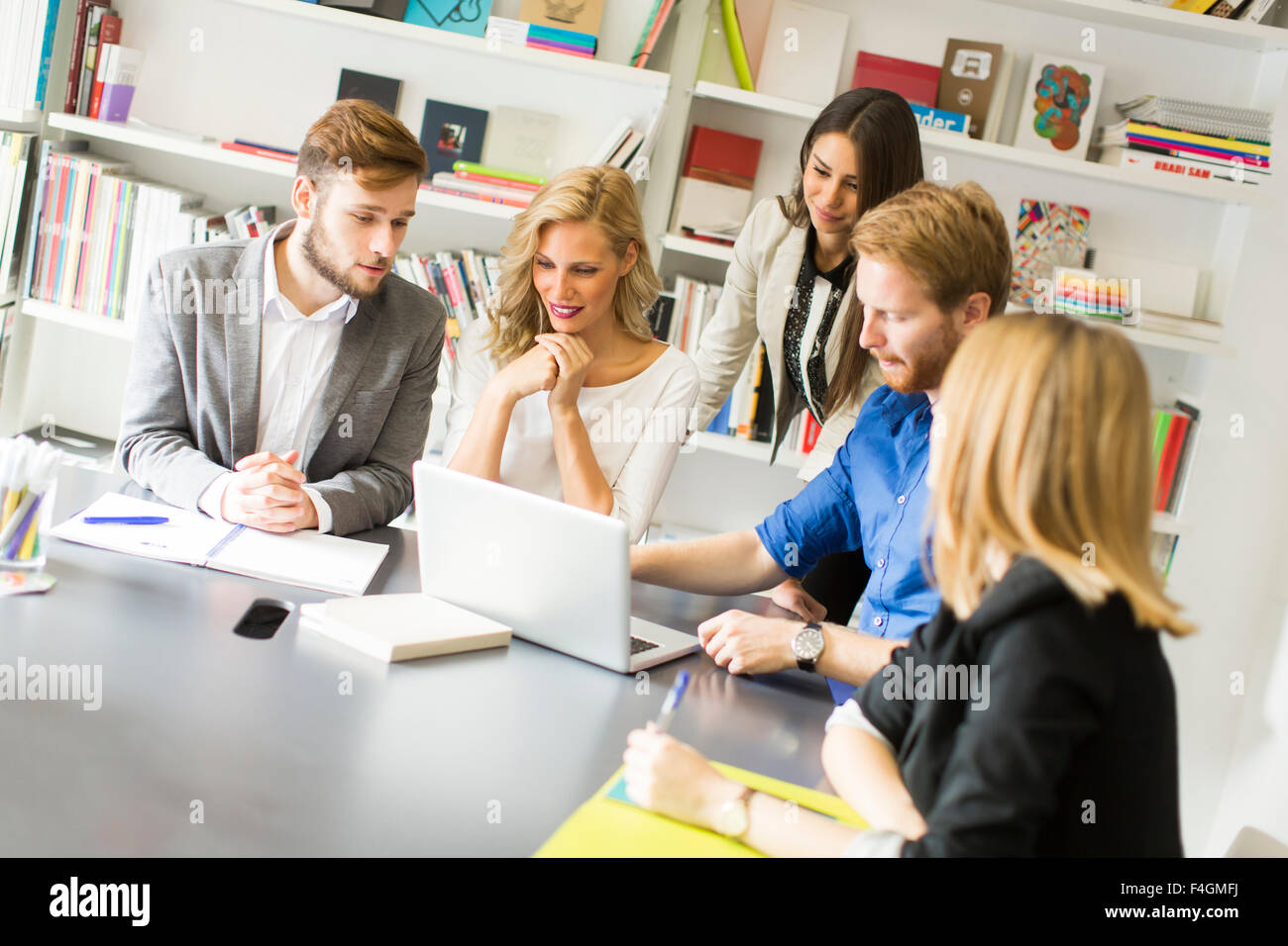 Young people in the office Stock Photo - Alamy