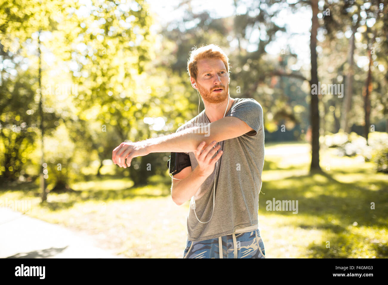 Young man resting outdoors Stock Photo - Alamy