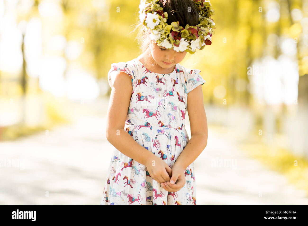 Little girl in the summer park Stock Photo - Alamy