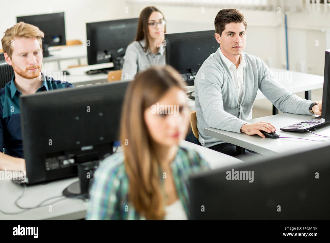 Young people in the classroom Stock Photo - Alamy