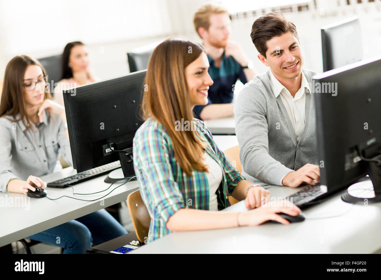 Young people in the classroom Stock Photo - Alamy