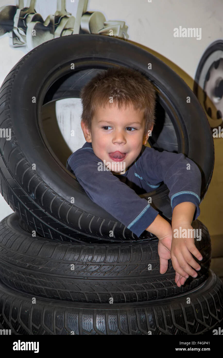 Boy in the auto repair shop Stock Photo - Alamy