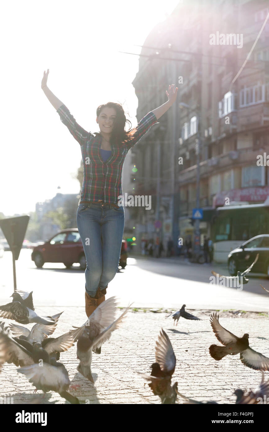 Young girl feeling happy in downtown Stock Photo - Alamy