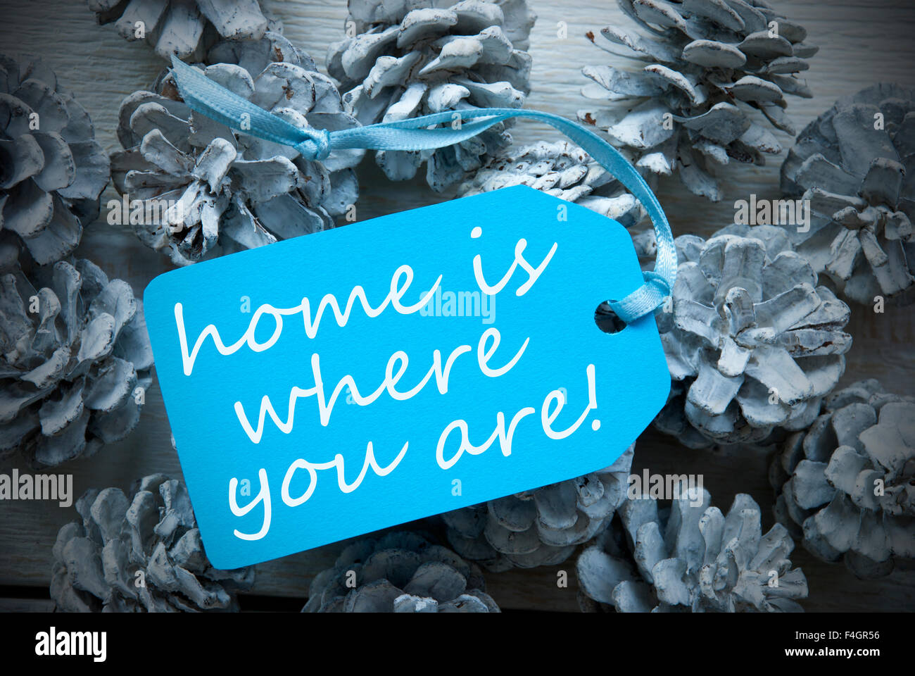 Light Blue Label On Fir Cones Quote Home Where Are Stock Photo - Alamy