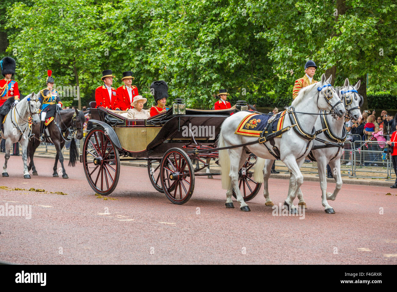 A Carriage carrying The Queen and Prince Philip ride along The Mall ...