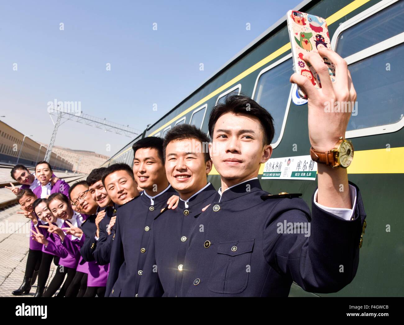 Urumqi, China's Xinjiang Province. 18th Oct, 2015. Staff members of an ...