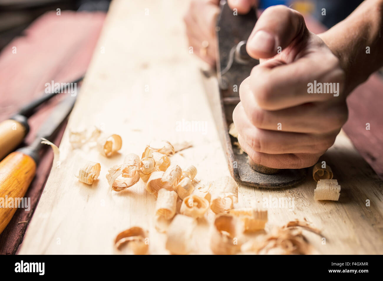 Man working with hand jack plane, close up photo Stock Photo - Alamy