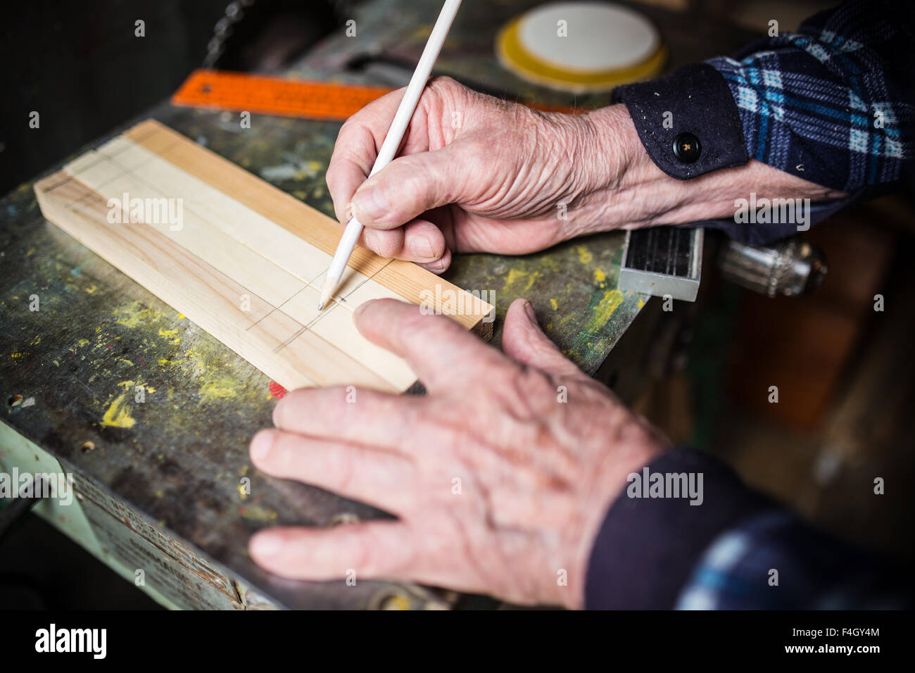 Hand carpenter taking measurement hi-res stock photography and images ...