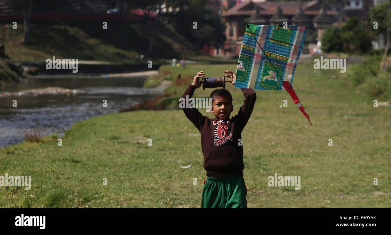Kathmandu, Nepal. 18th Oct, 2015. A Nepalese boy flies a kite in ...