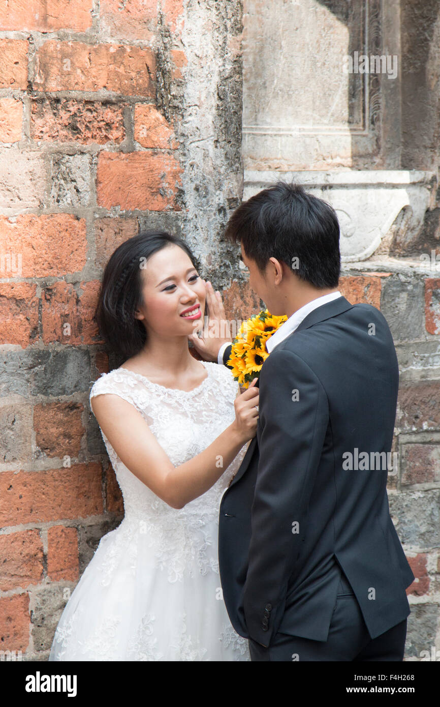 young vietnamese newly married couple have their wedding photographs ...