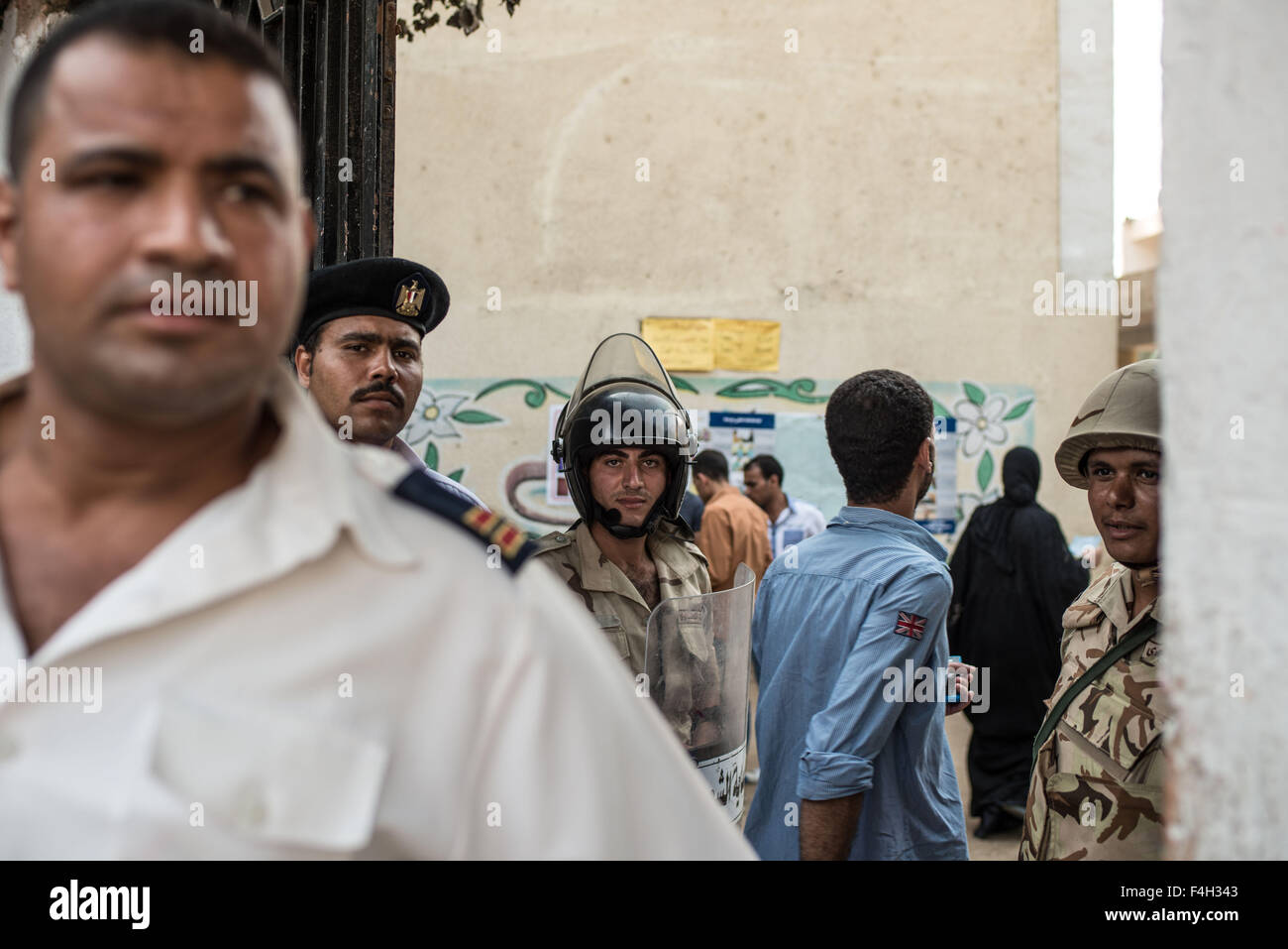 Giza. 18th Oct, 2015. Egyptian security personnel stand guard outside a ...