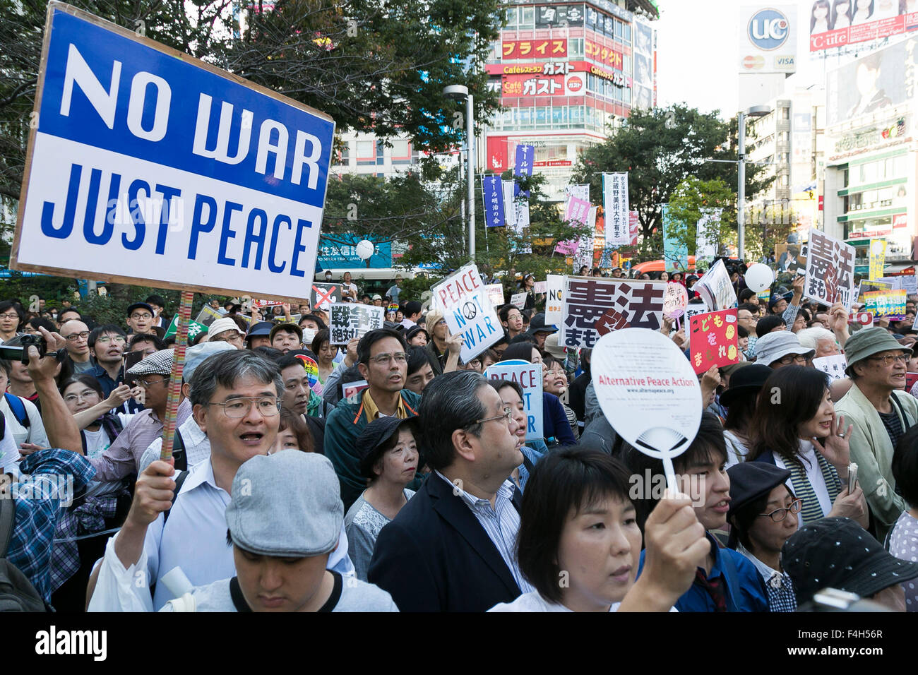 Demonstrators hold placards calling for democracy during a protest ...
