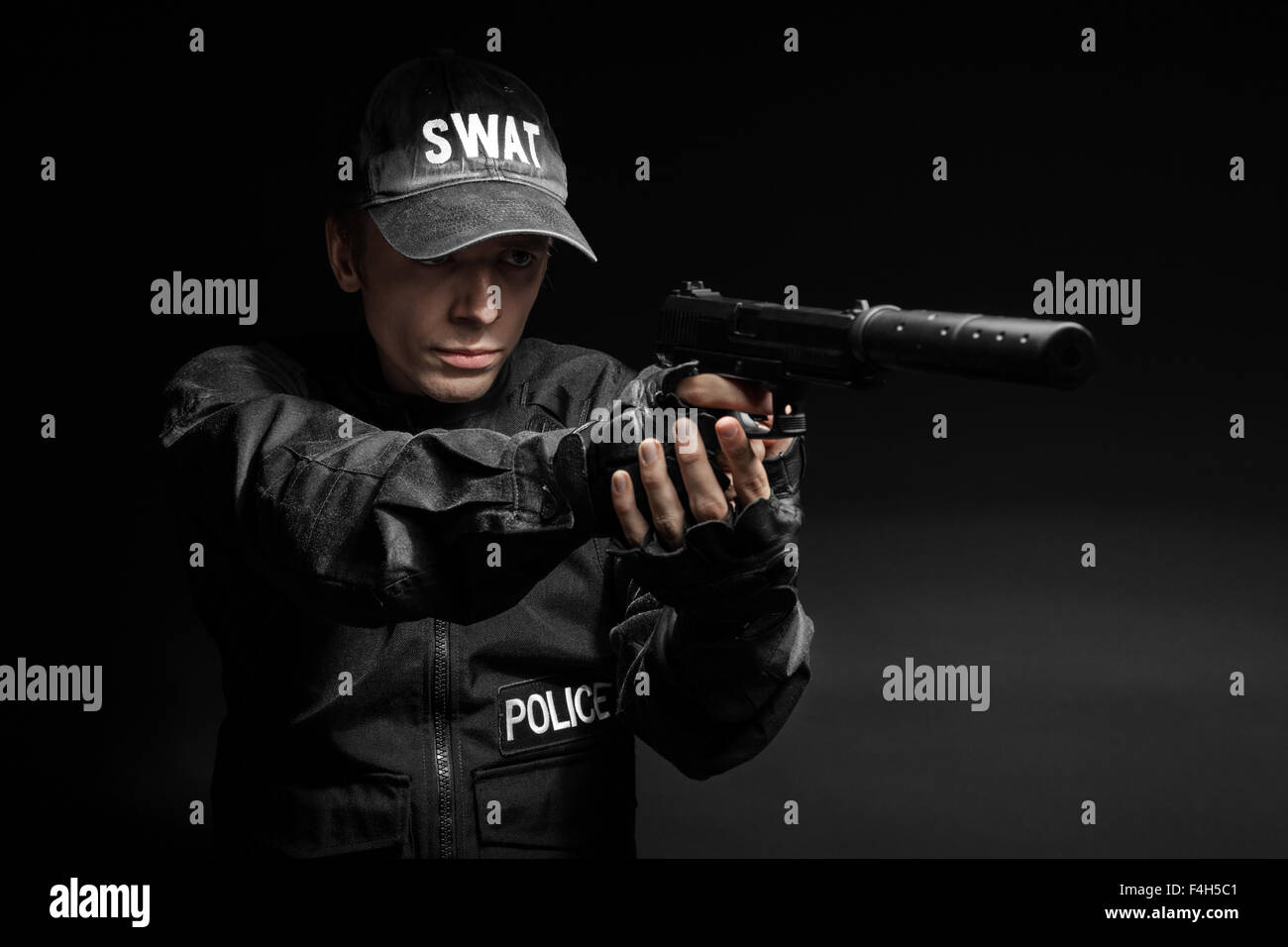 SWAT police officer with pistol Stock Photo - Alamy