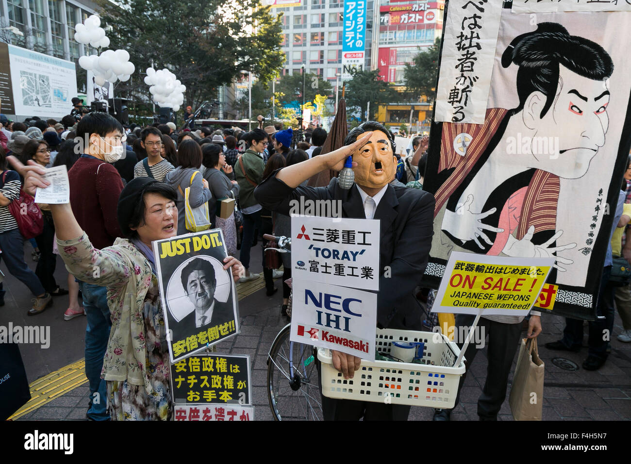 Demonstrators hold placards calling for democracy during a protest ...