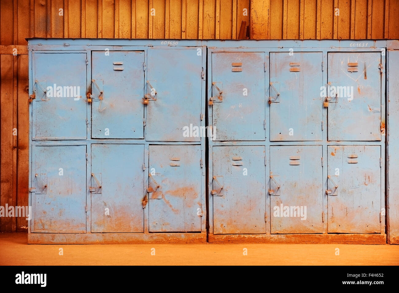 Old and rusty blue lockers abandoned inside industrial building Stock ...