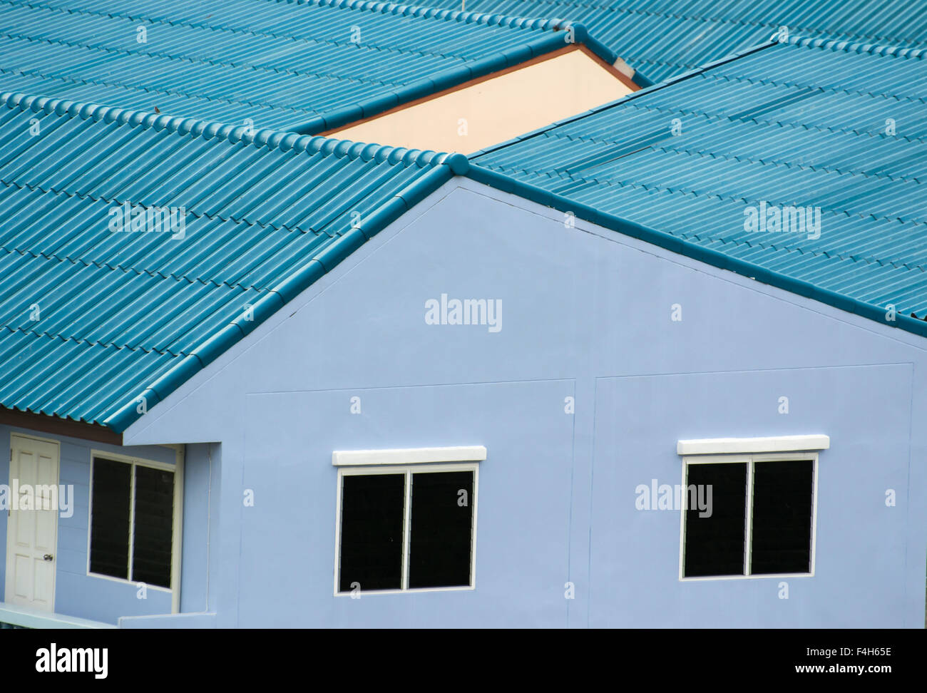 Blue roof on a new houses Stock Photo - Alamy