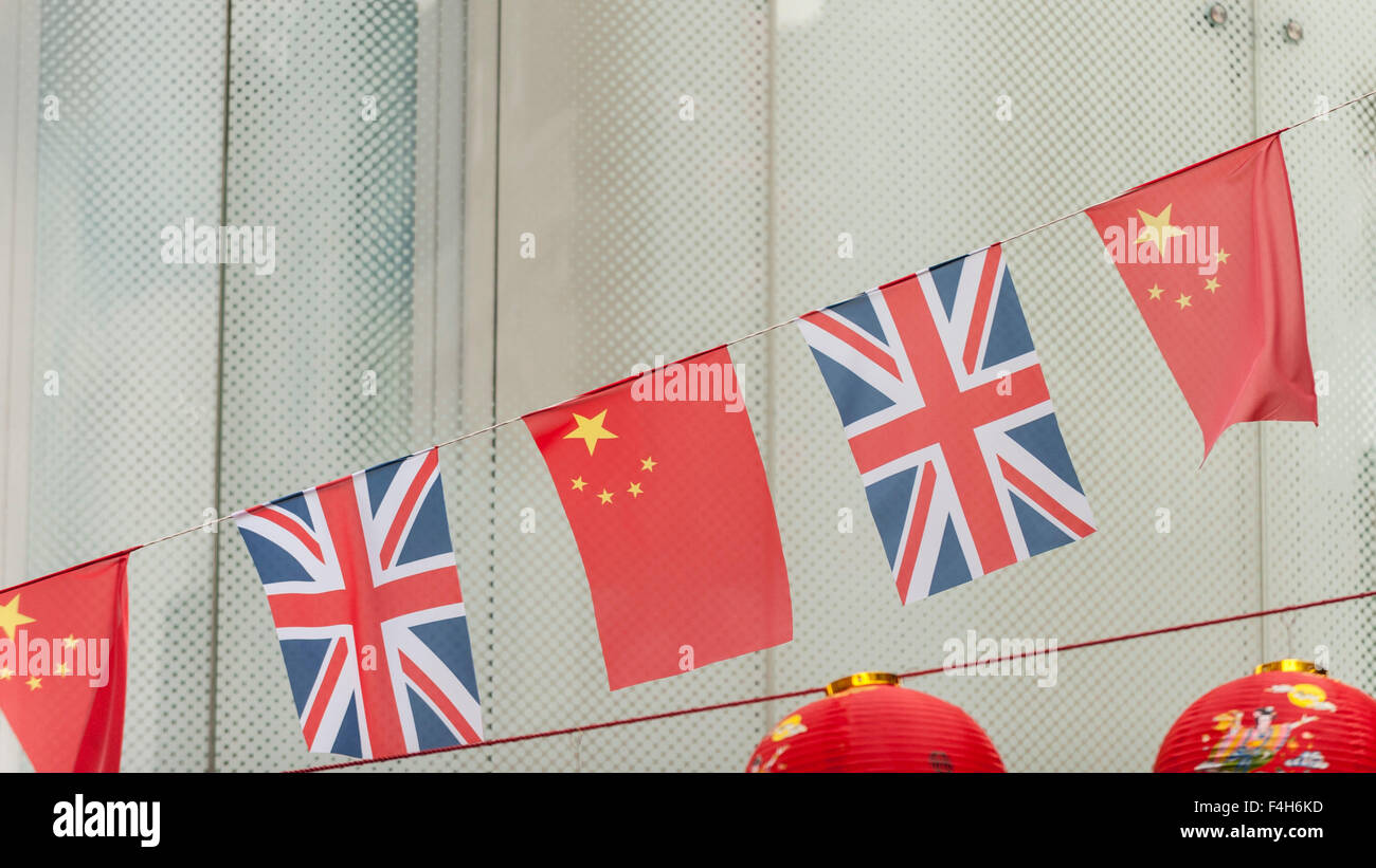 London, UK. 18 October 2015. Chinese flags and Union Jack flags hang ...