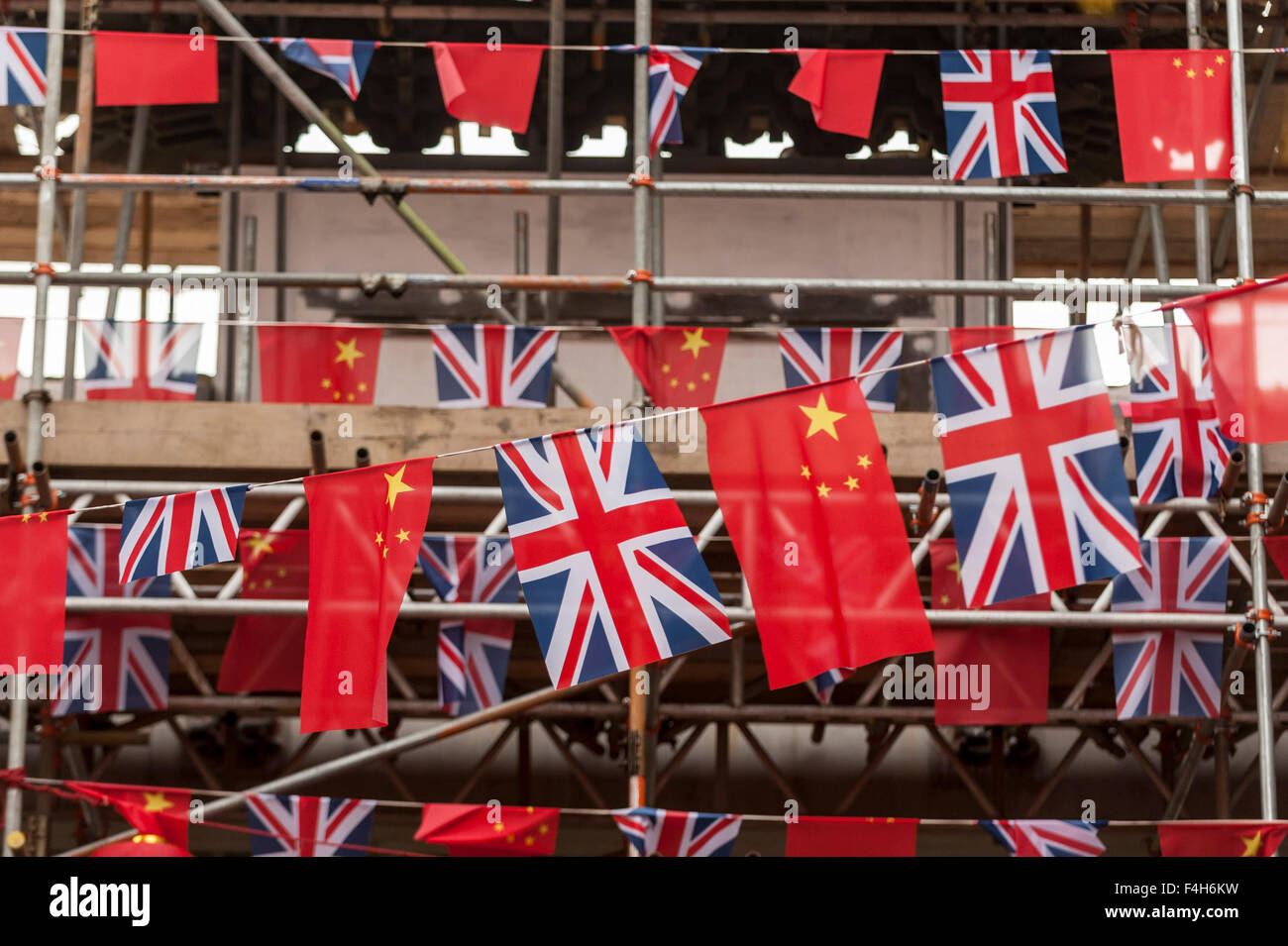 London, UK. 18 October 2015. Chinese flags and Union Jack flags hang ...