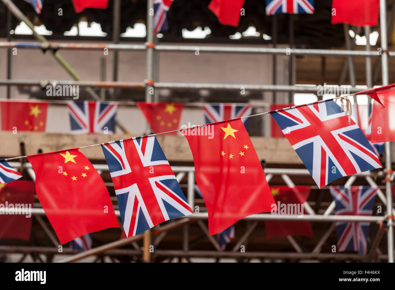 London, UK. 18 October 2015. Chinese flags and Union Jack flags hang ...