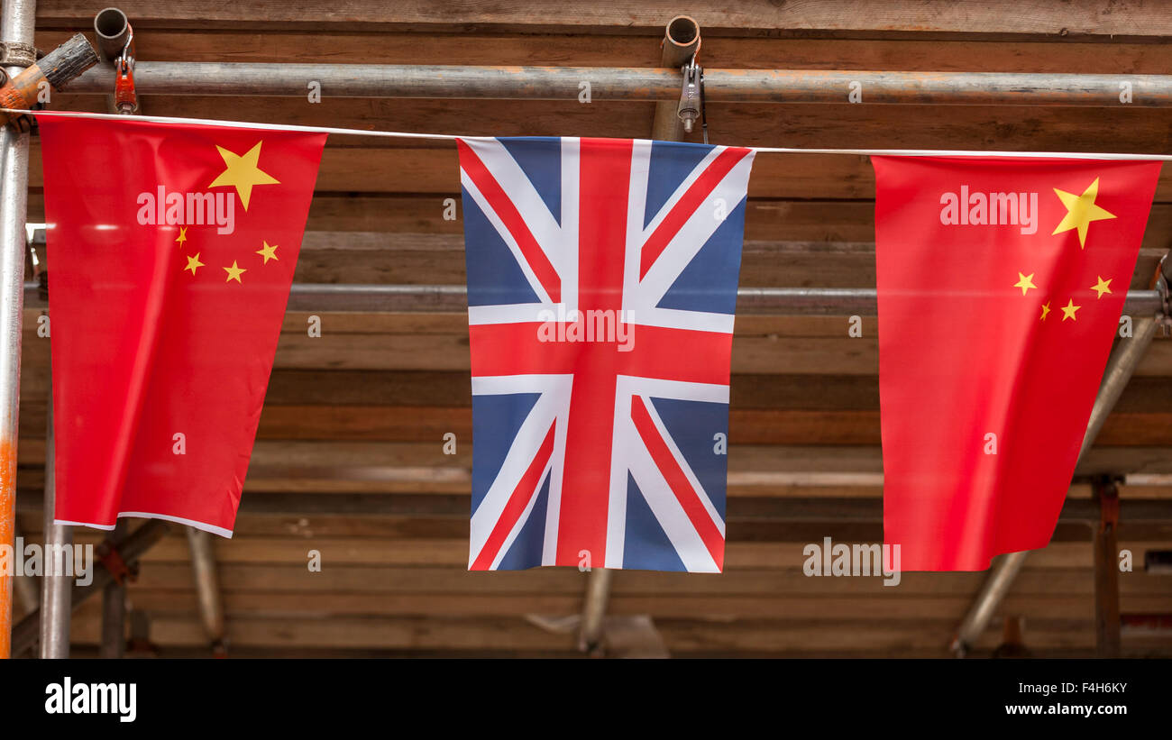 London, UK. 18 October 2015. Chinese flags and Union Jack flags hang ...
