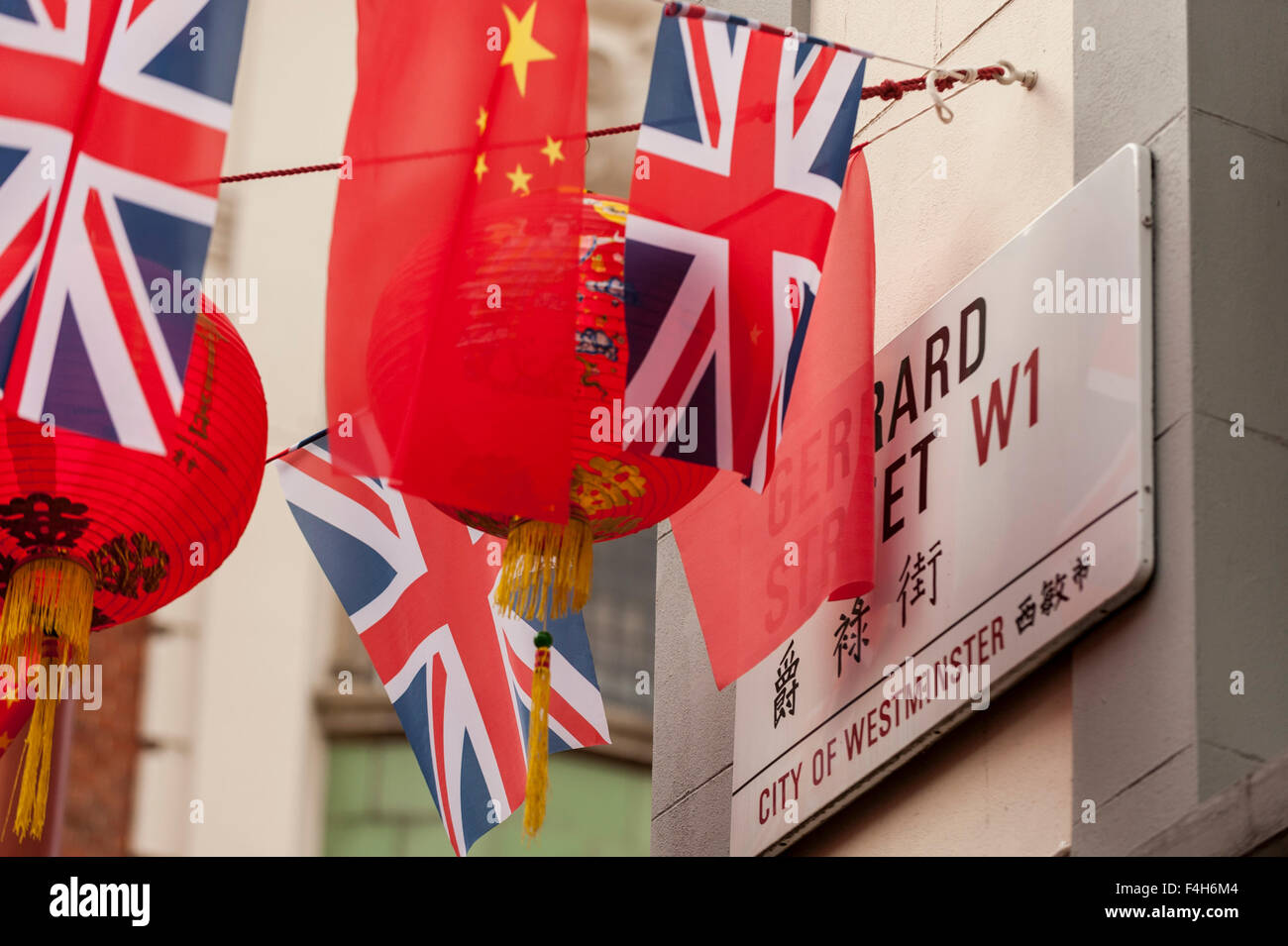 London, UK. 18 October 2015. Chinese flags and Union Jack flags hang ...