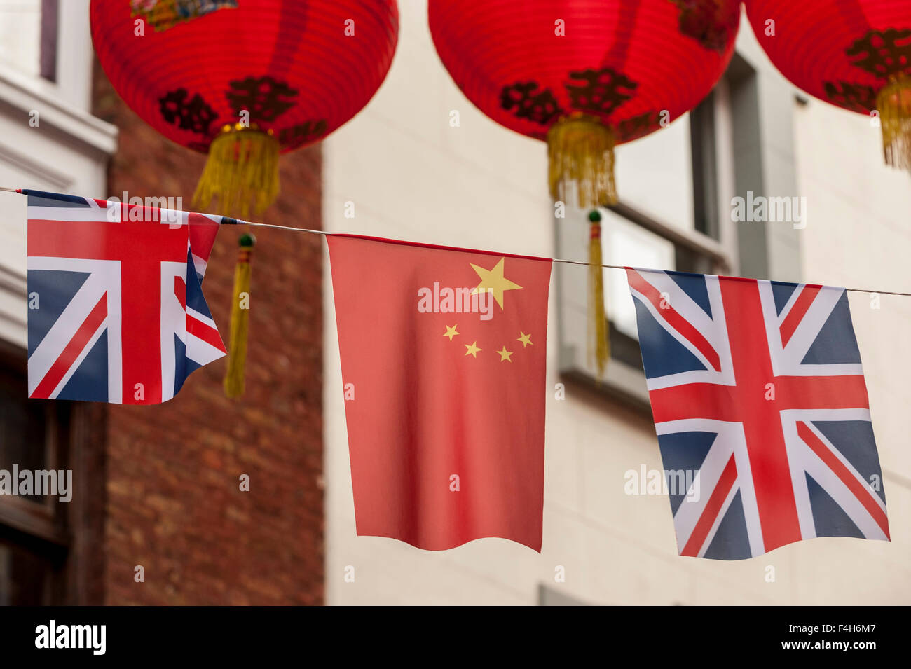 London, UK. 18 October 2015. Chinese flags and Union Jack flags hang ...