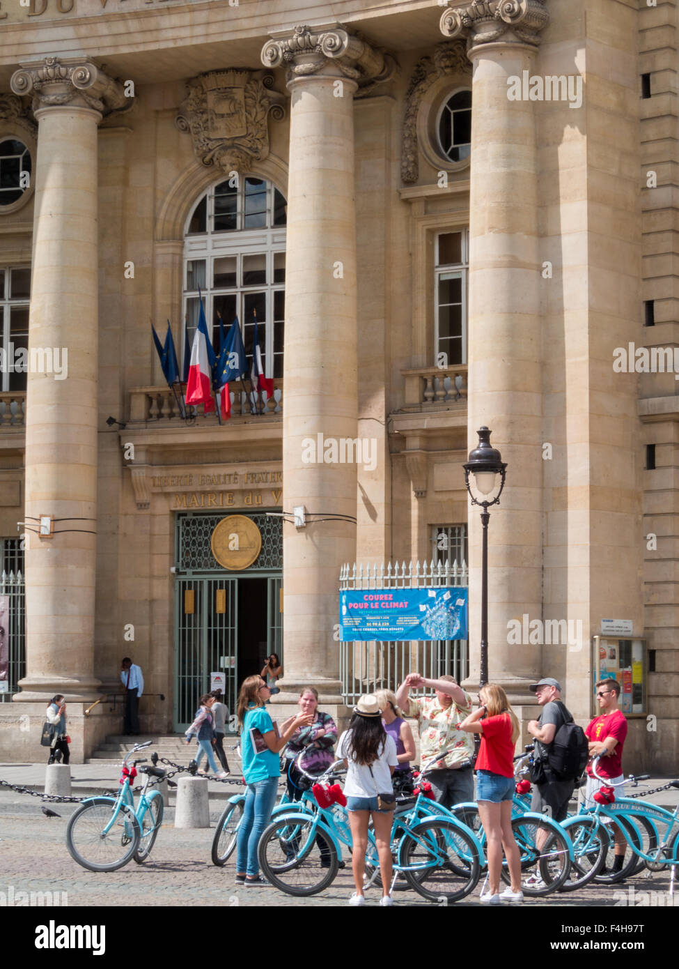 Cycling tourist group in the Paris streets Stock Photo - Alamy