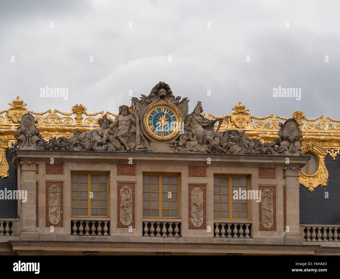 Versailles Palace facade detail with golden roof and clock Stock Photo ...