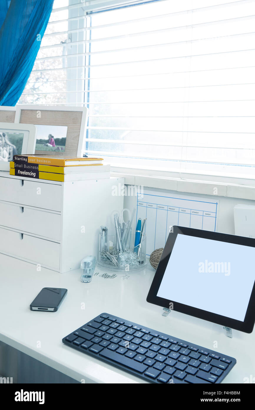 Home and Business office interior set up with a mobile phone and tablet ...