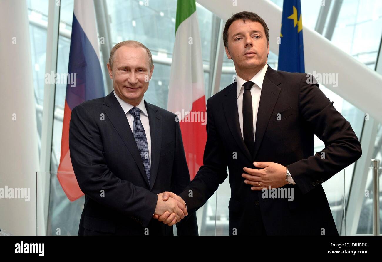 Russian President Vladimir Putin shakes hands with Italian Prime ...