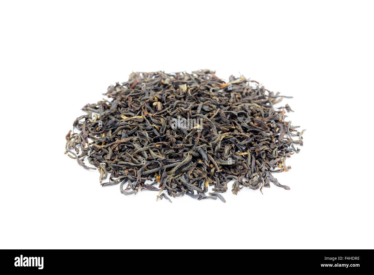 Heap of loose black tea Assam isolated on white background Stock Photo ...