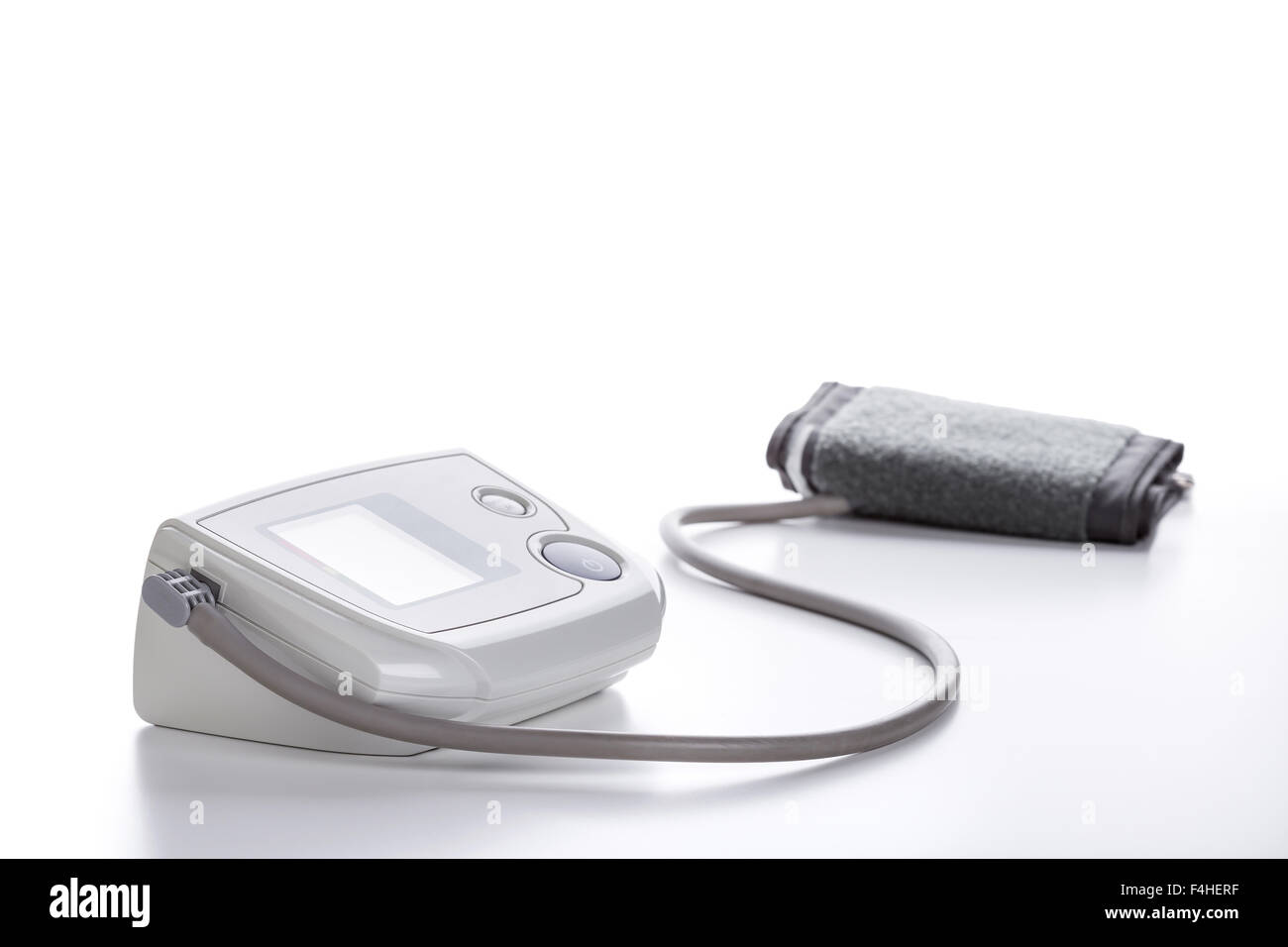 Digital Blood Pressure Monitor closeup on white background Stock Photo ...
