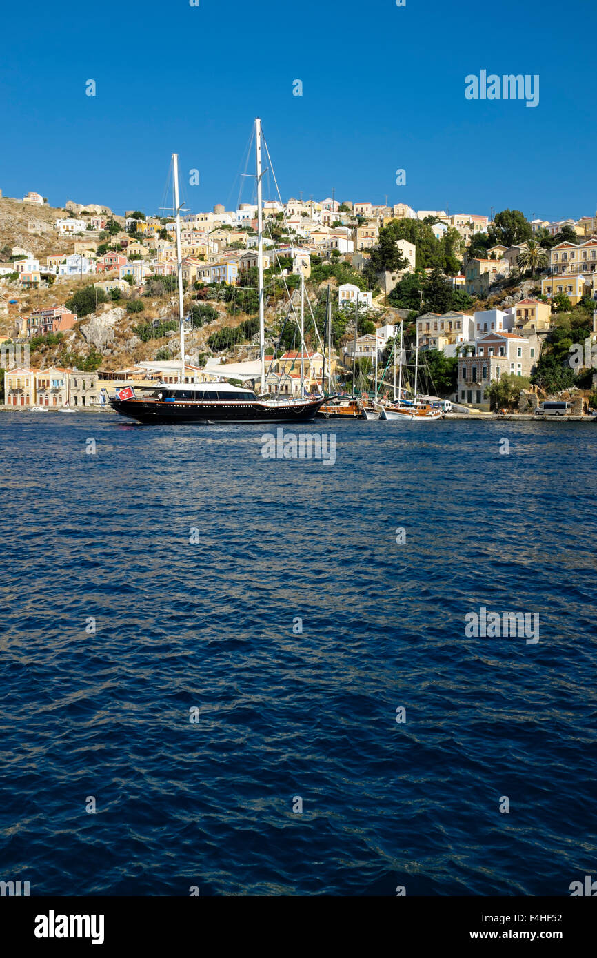 Twin masted sailing ship in Yialos harbour, on the Greek island of Symi ...