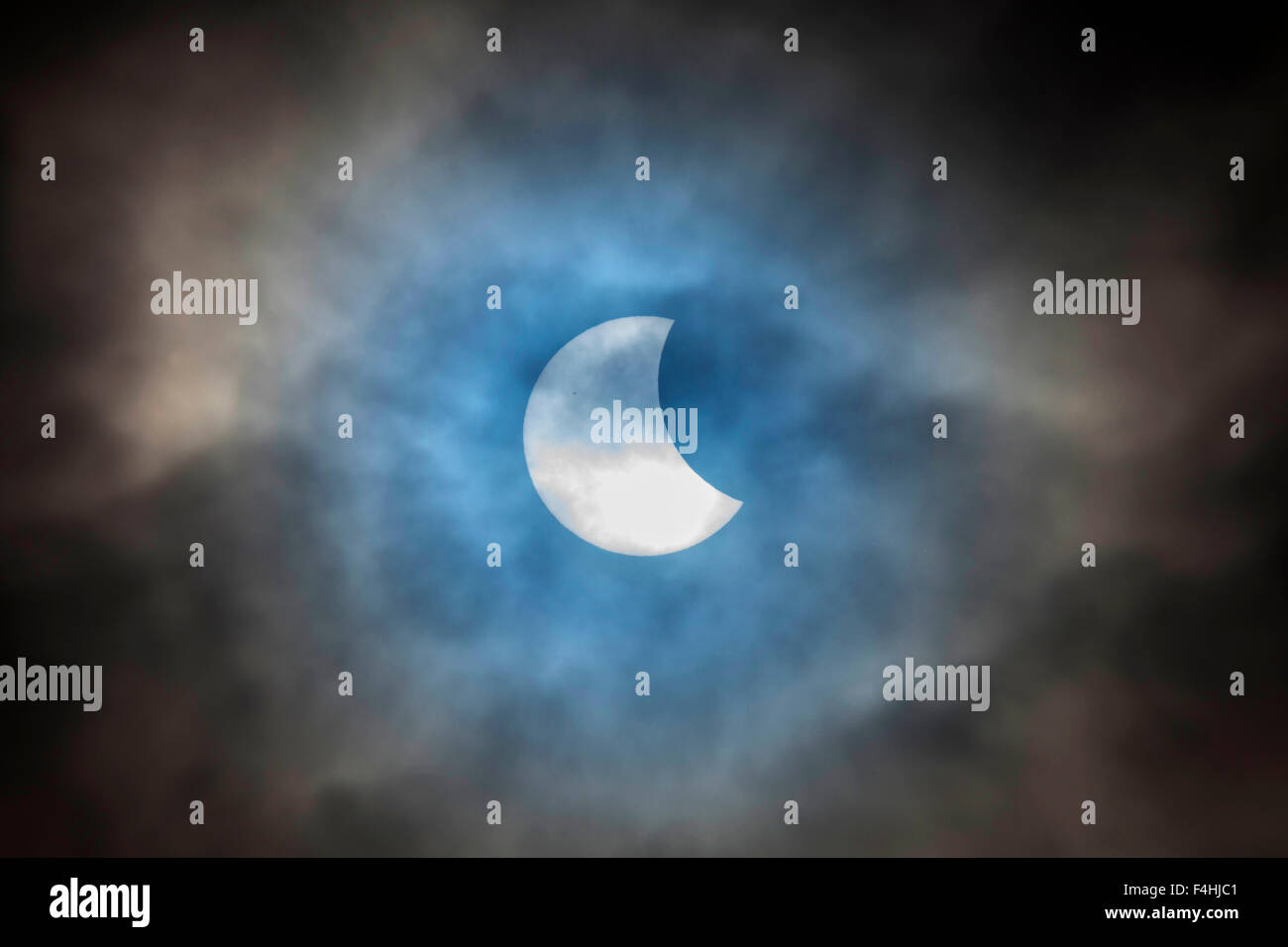Partial solar eclipse seen through the clouds in Leeds UK on Friday ...