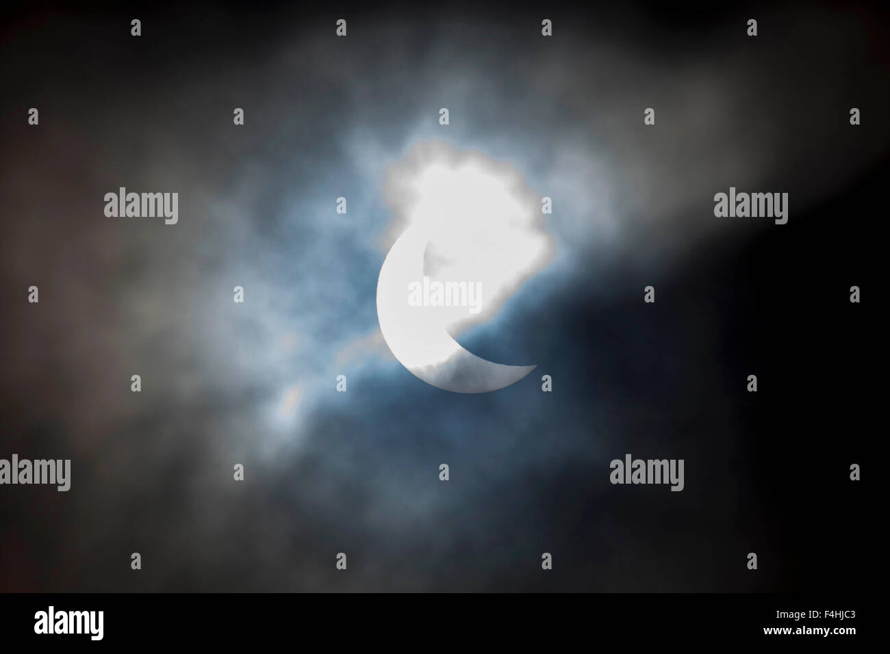 Partial solar eclipse seen through the clouds in Leeds UK on Friday ...