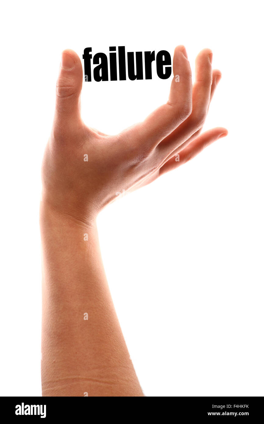Color vertical shot of a of a hand squeezing the word "failure Stock ...