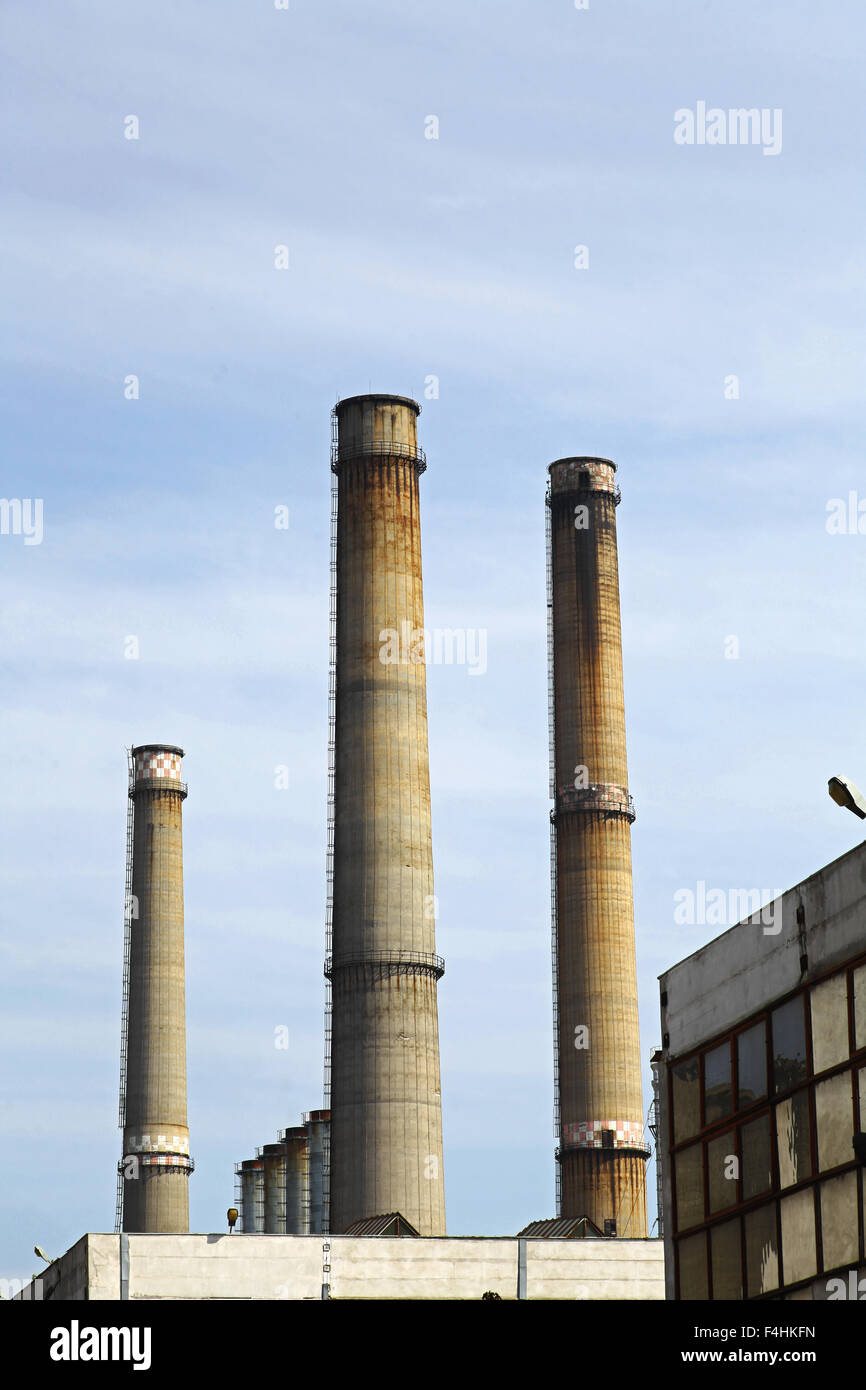 Color image of some chimneys at a factory Stock Photo - Alamy