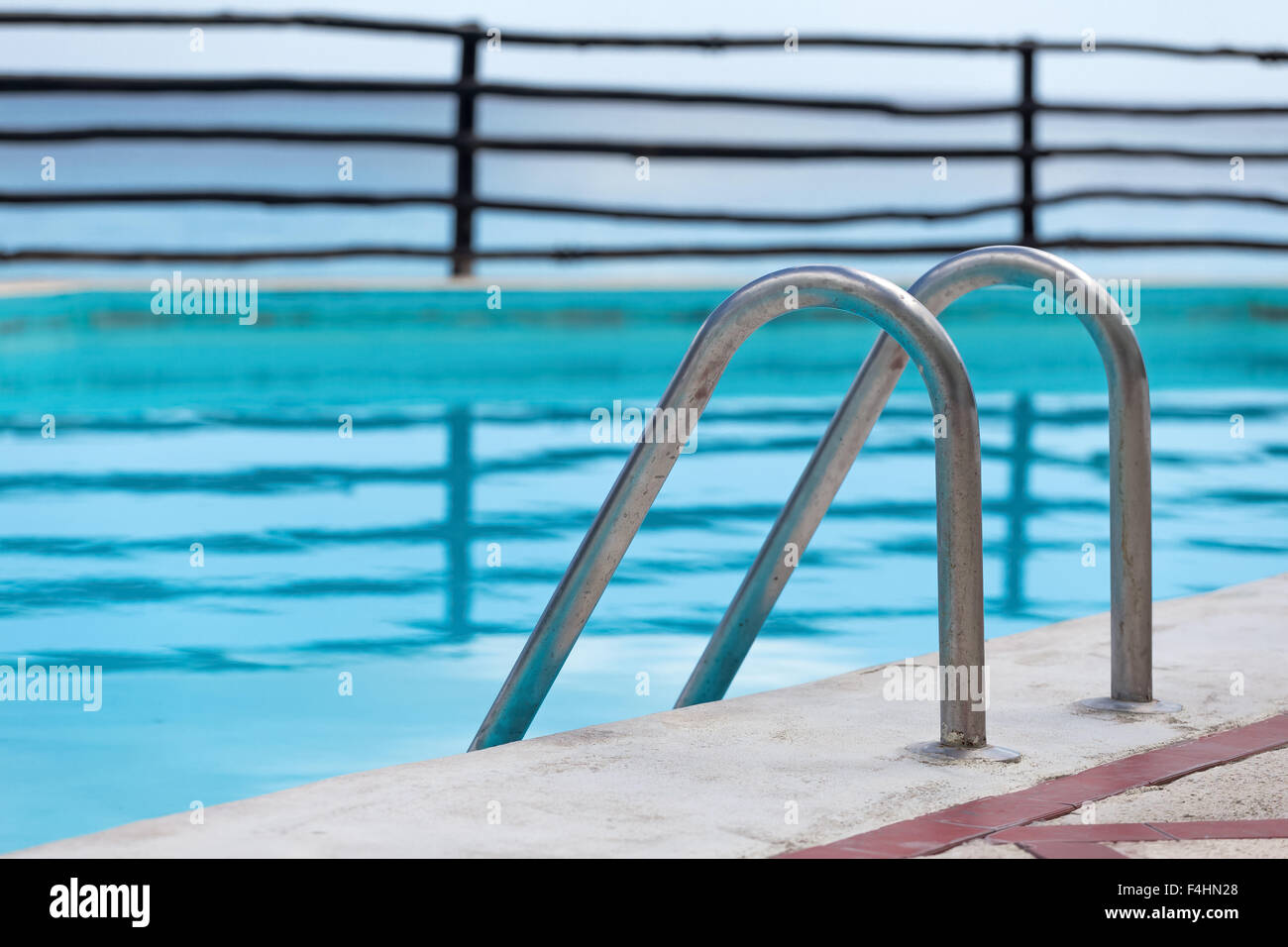 Grab bars ladder in swimming pool, outdoors at the day time Stock Photo ...
