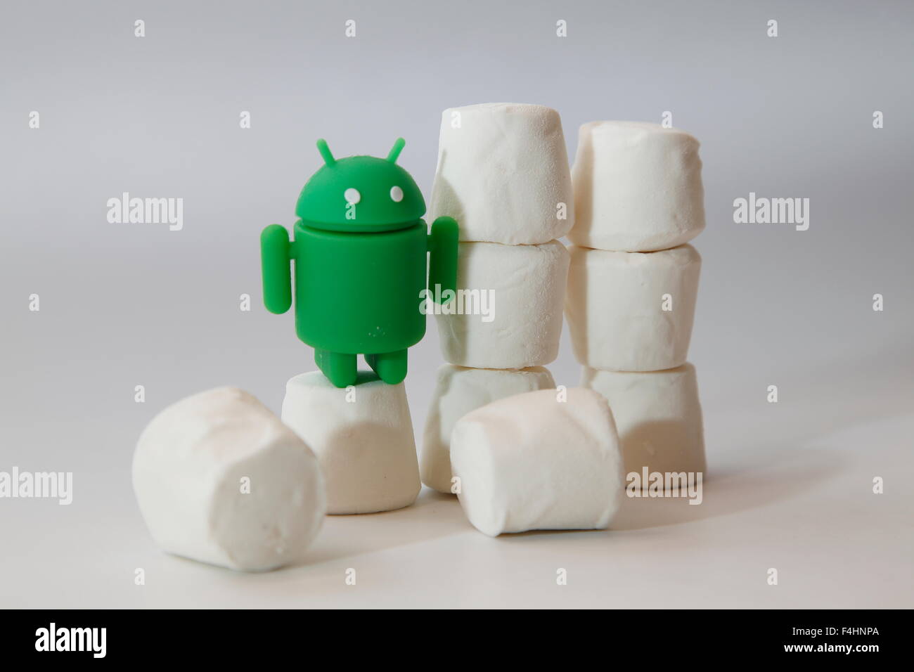 A green Android robot peers from within a pile of marshmallows. Google ...