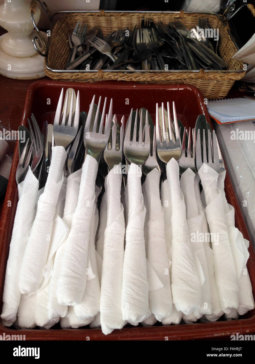 Baskets of forks covered with paper napkins Stock Photo - Alamy